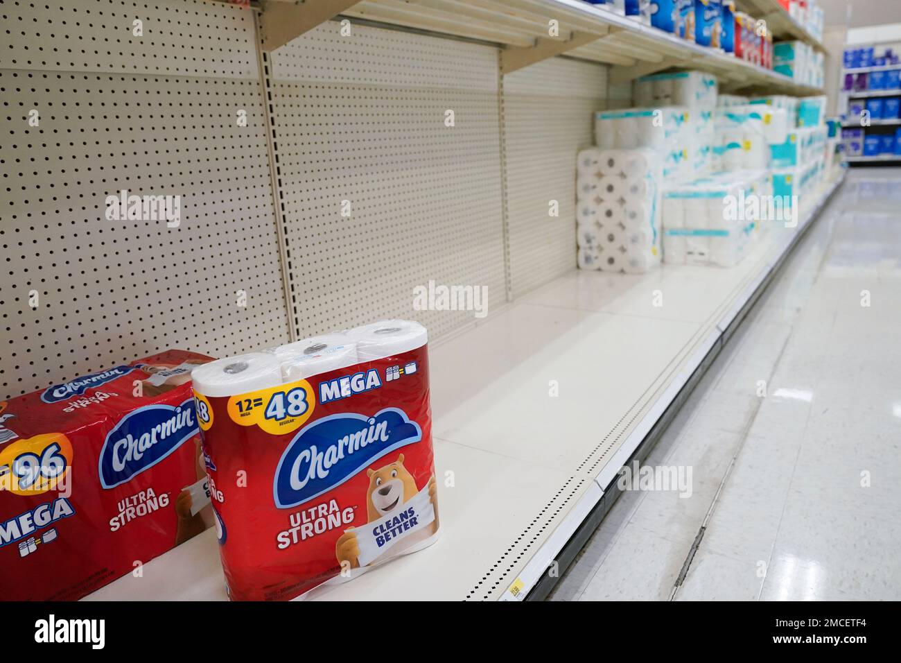 A section of shelves lies mostly empty at a Target store in Hackensack ...