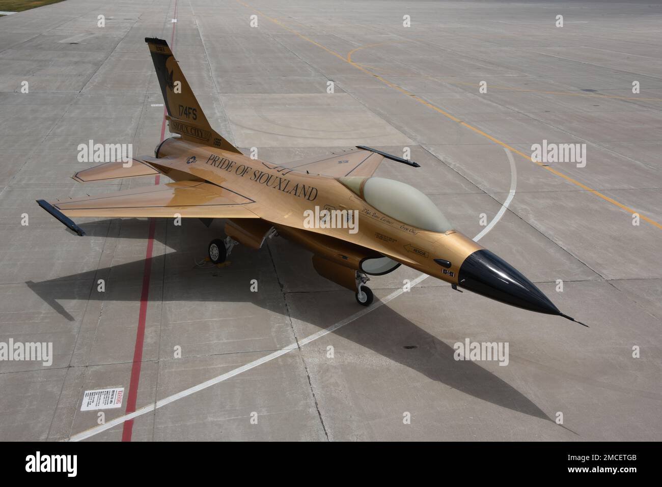A gold U.S. Air Force F-16A Falcon from the Iowa Air National Guard is ...