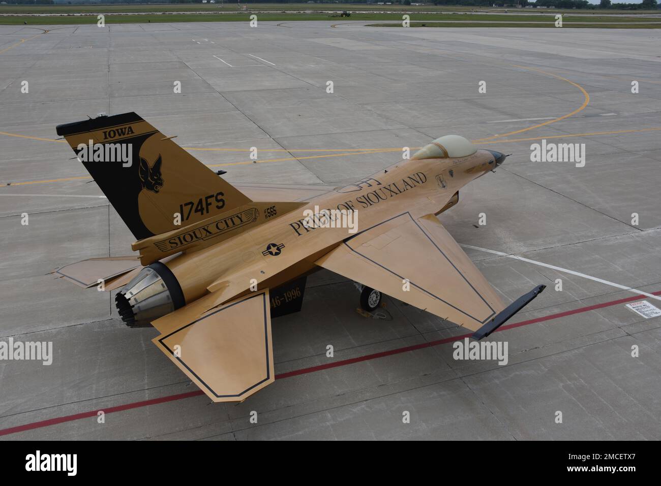 A gold U.S. Air Force F-16A Falcon from the Iowa Air National Guard is ...