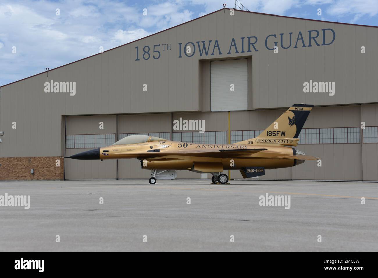 A gold U.S. Air Force F-16A Falcon from the Iowa Air National Guard is ...