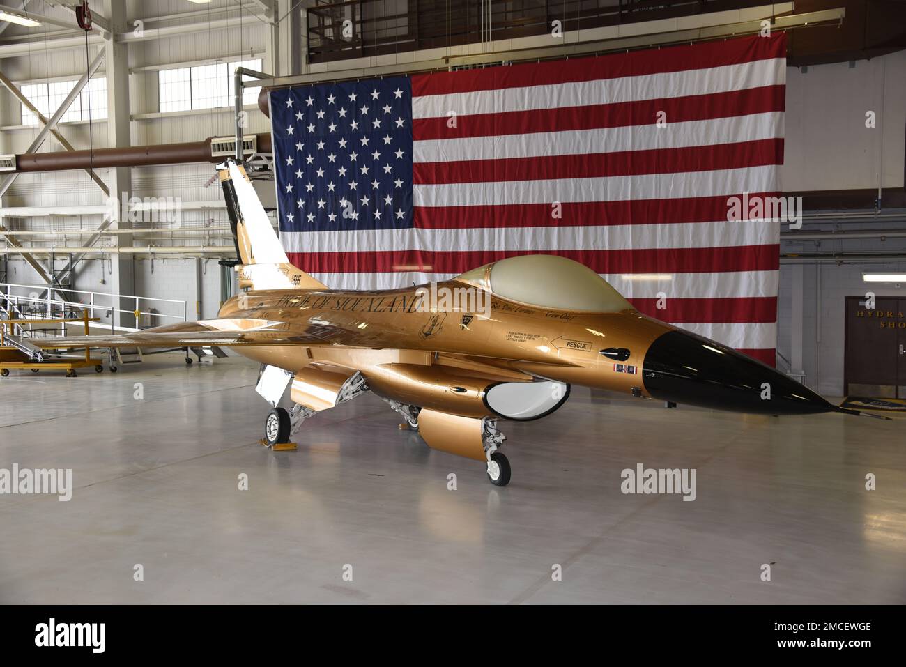 A gold U.S. Air Force F-16A Falcon from the Iowa Air National Guard is ...