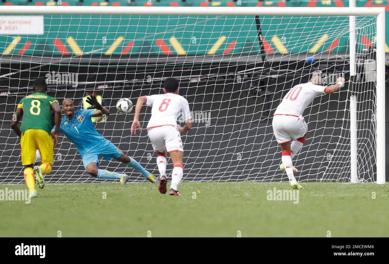 Mali's goalkeeper Ibrahima Mounkoro, left, dives for the ball kicked by ...