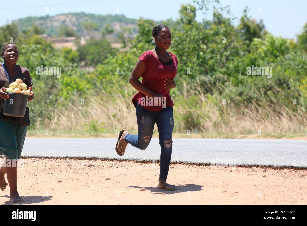 Virginia Mavhunga, a 13-year-old teenage mother, runs after clients ...