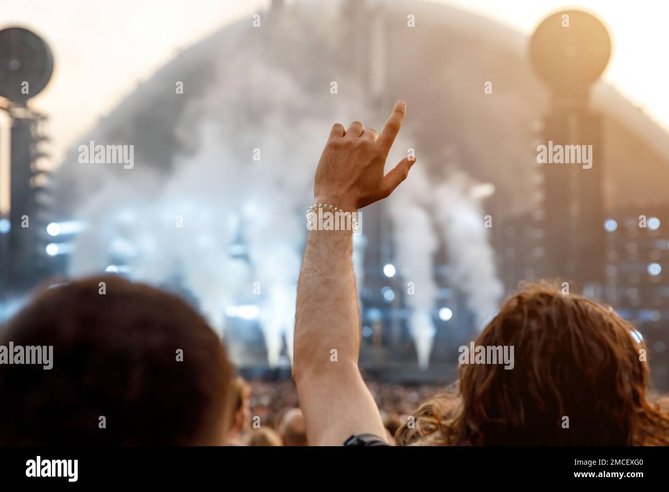 People with raised hands enjoy music concert Stock Photo - Alamy