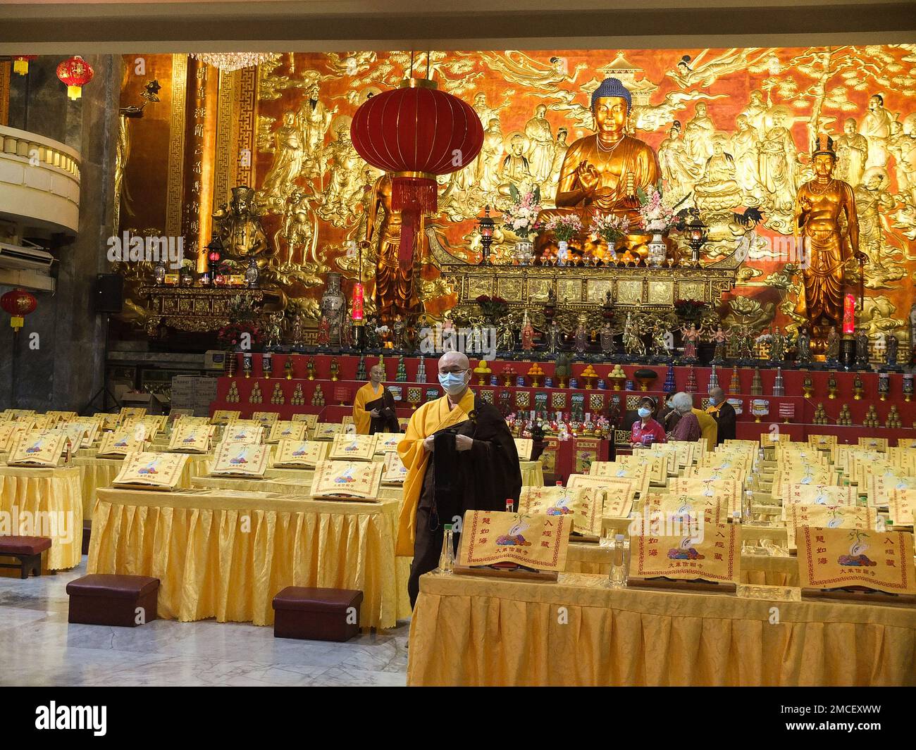 A Buddhist monk leaves the prayer hall after the year-end ritual ...