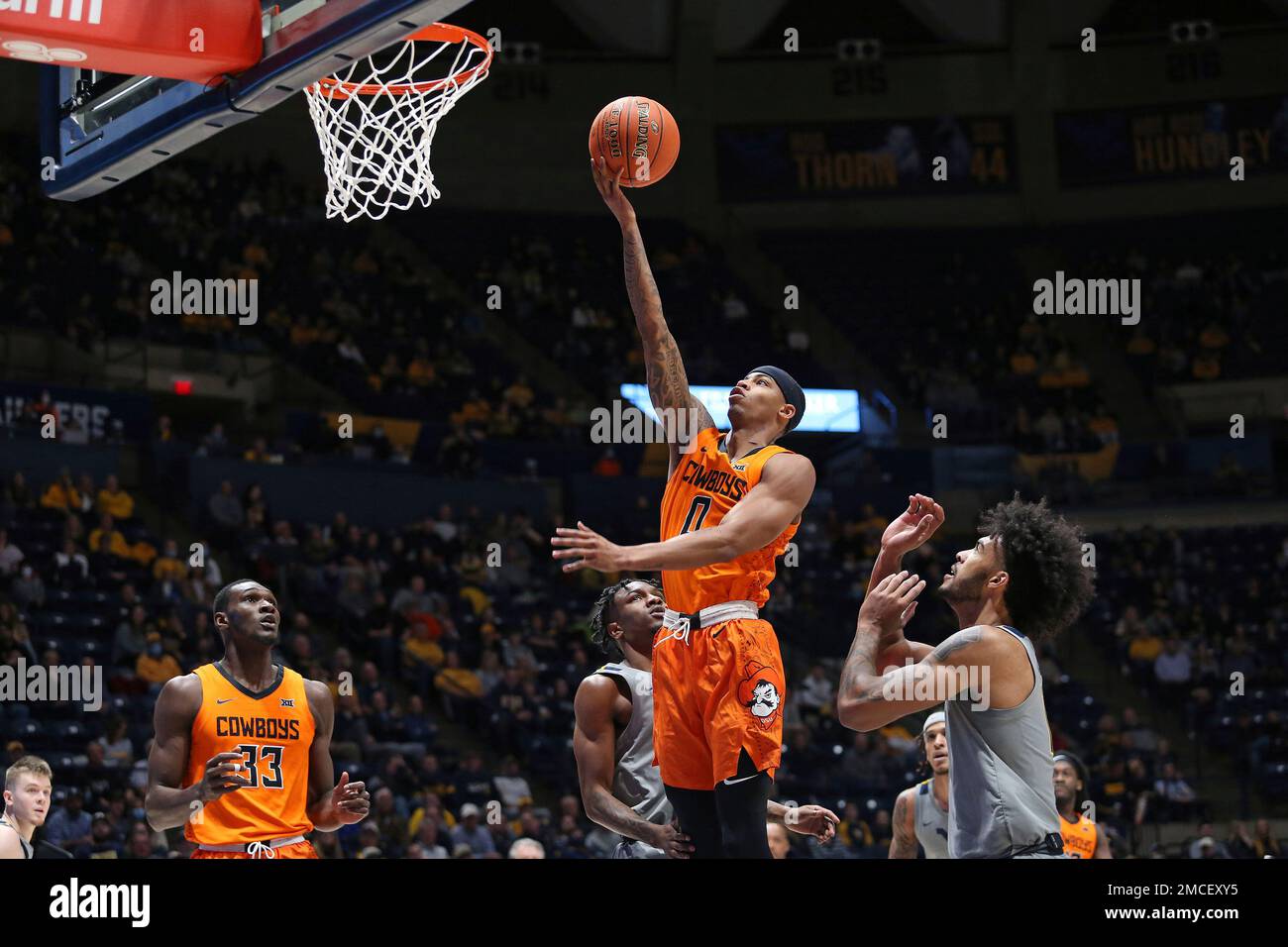 Oklahoma State guard Avery Anderson III (0) shoots while defended by ...