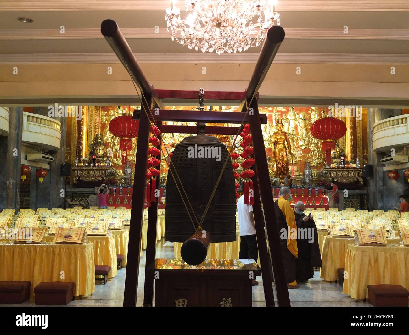 A Buddhist gong at the prayer hall of the temple. Buddhist monks from ...