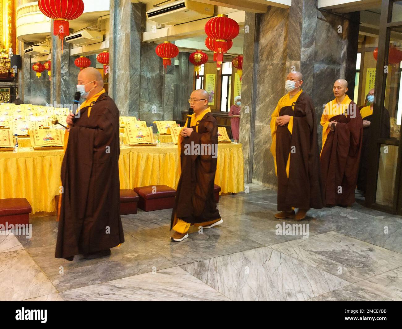 Buddhist monks circling around the temple's prayer hall during the year ...