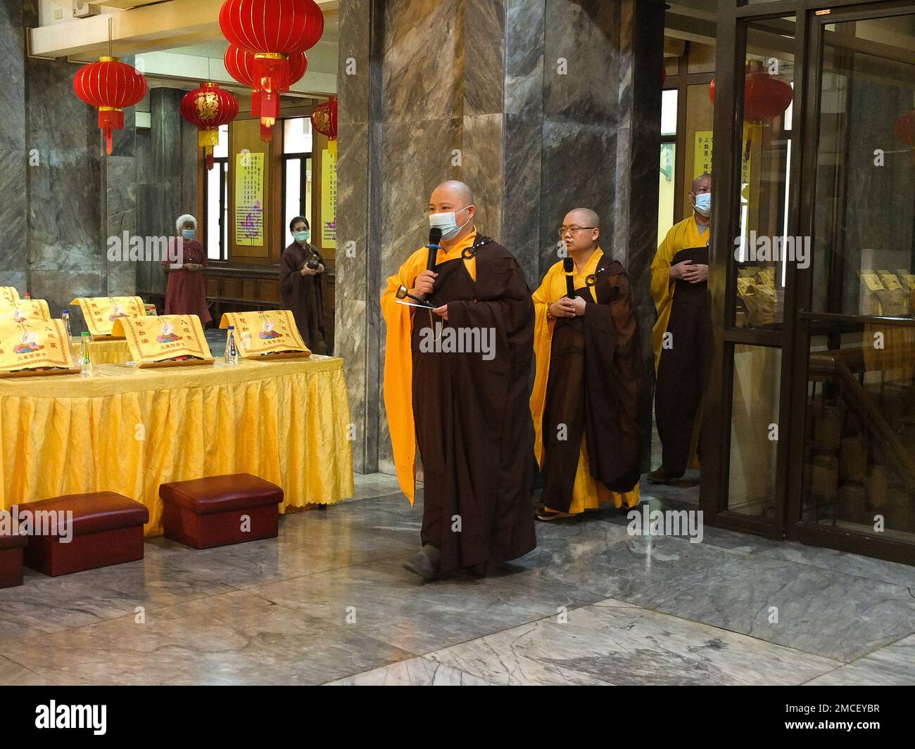 Buddhist monks circling around the temple's prayer hall during the year ...
