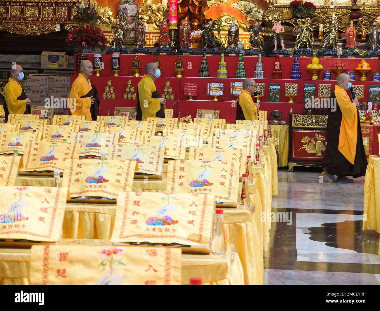 Buddhist monks chanting prayer while walking around the Seng Guan ...
