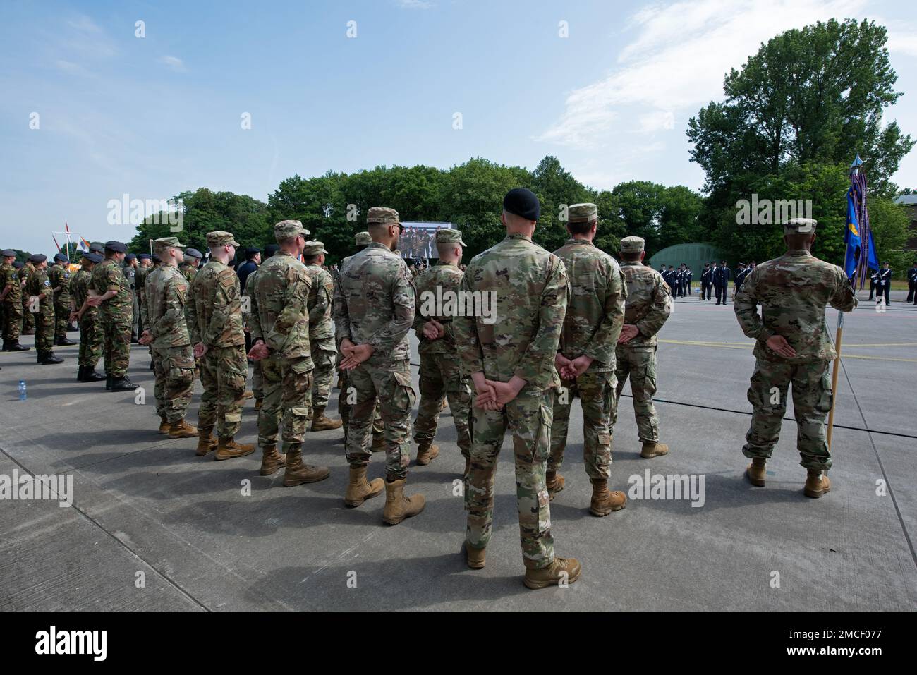 U.S. Airmen participate in a change of command ceremony with members of ...