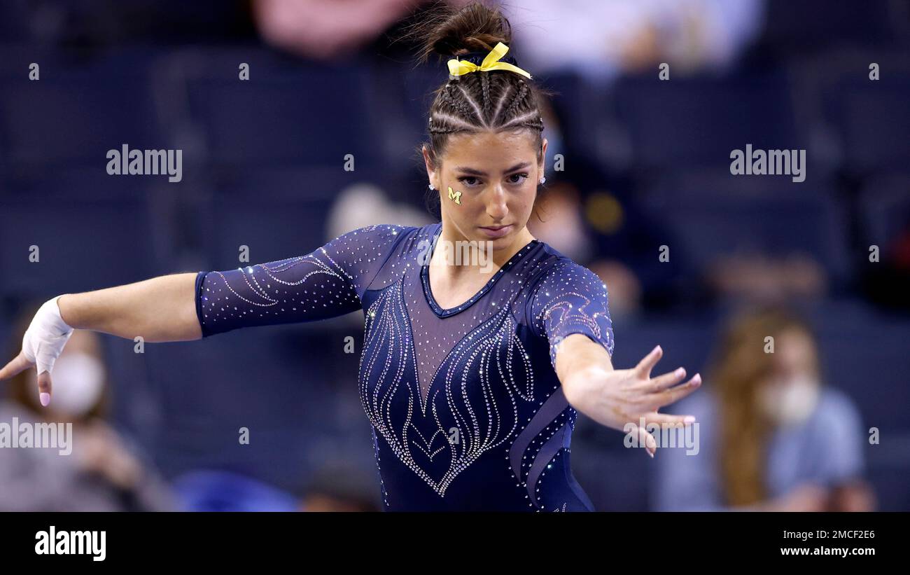 Michigan's Nicoletta Koulos performs on the beam during an NCAA ...