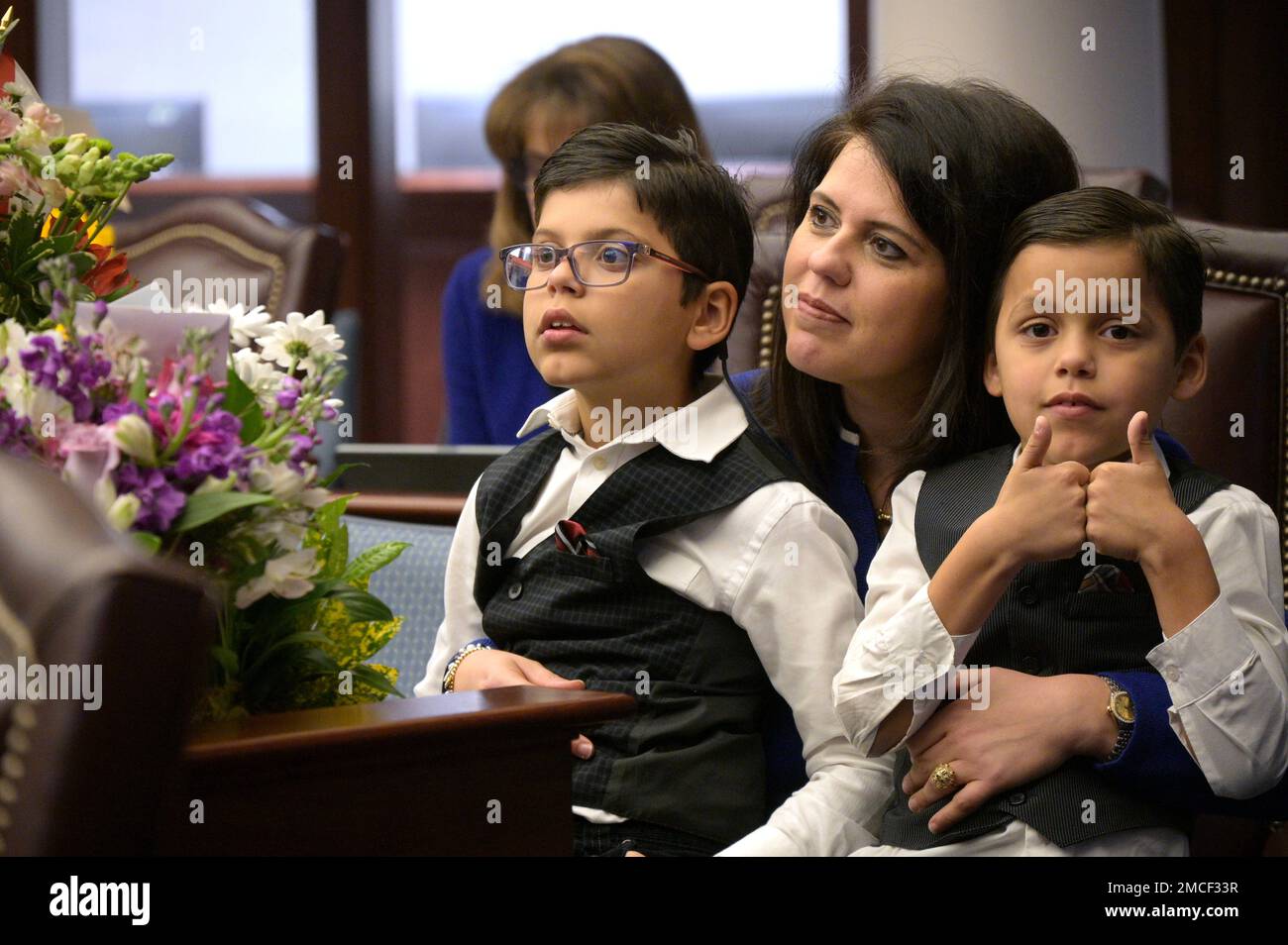 Florida Sen. Ana Maria Rodriguez sits with her sons Eros Canabal, 9 ...