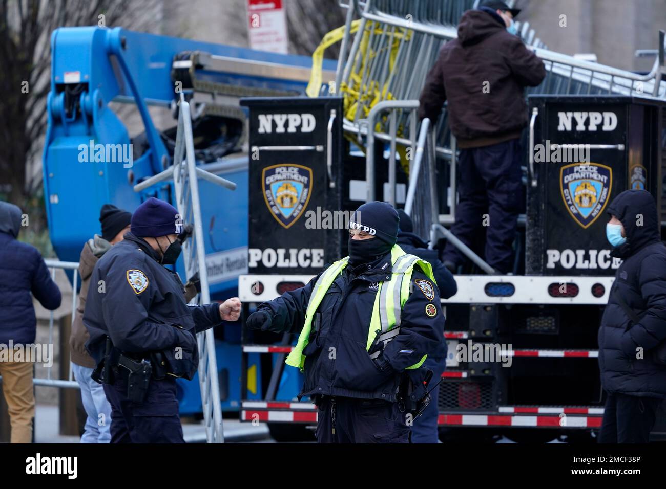 Police officers bundled up against the cold greet one another in New ...