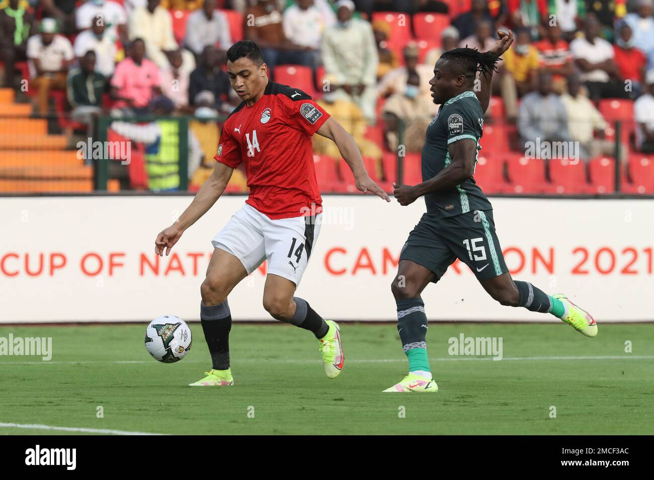 Egypt's Mostafa Mohamed , left, and Nigeria's Moses Simon fight for the ...