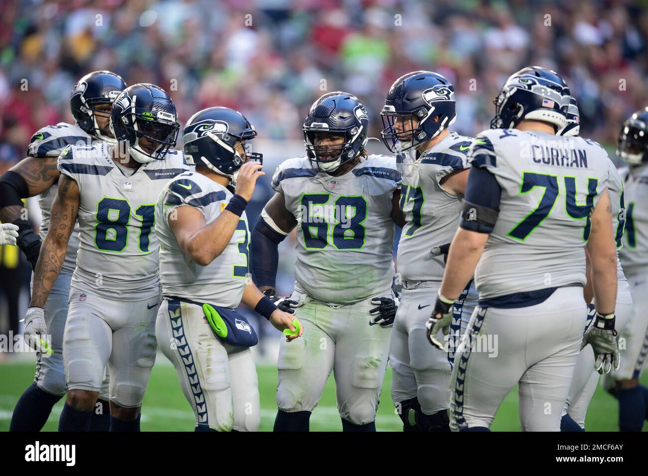 The Seattle Seahawks huddles while playing the Arizona Cardinals during ...