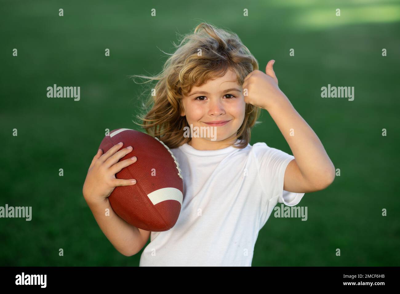 Outdoor kids sport activities. Child boy with american football, rugby ...