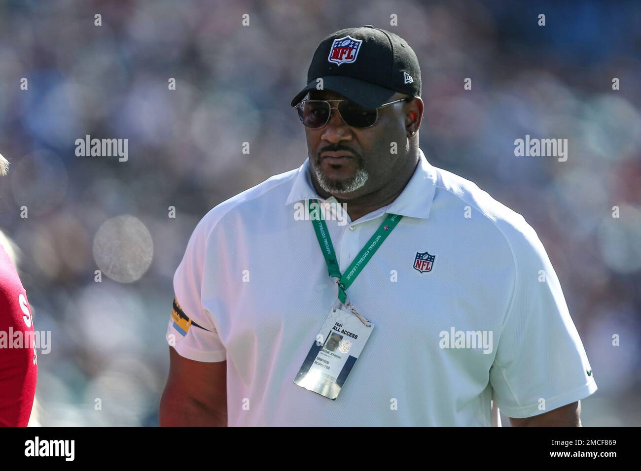 Retired NFL player, NFL staff member Reggie Johnson on the sidelines ...