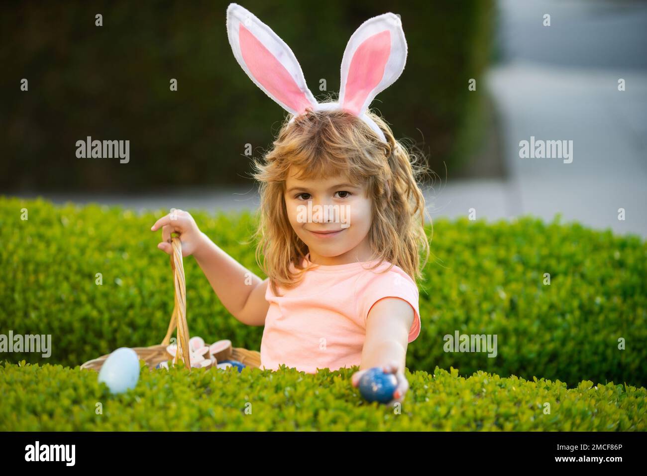 Kids boy hunting easter eggs. Easter kids boy in bunny ears hunting ...
