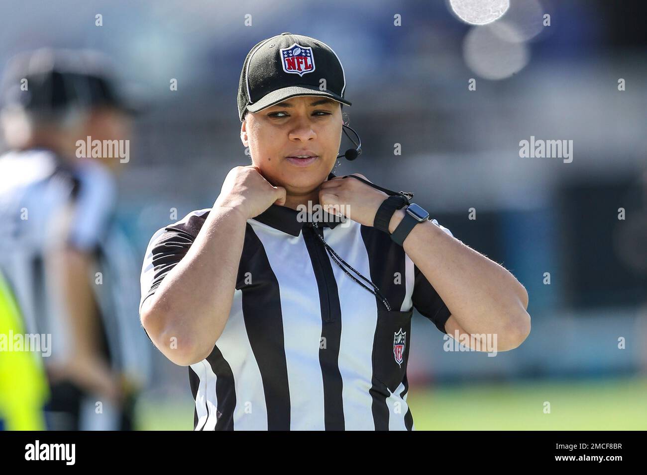 Line judge Maia Chaka (100) walks the field before of an NFL football ...