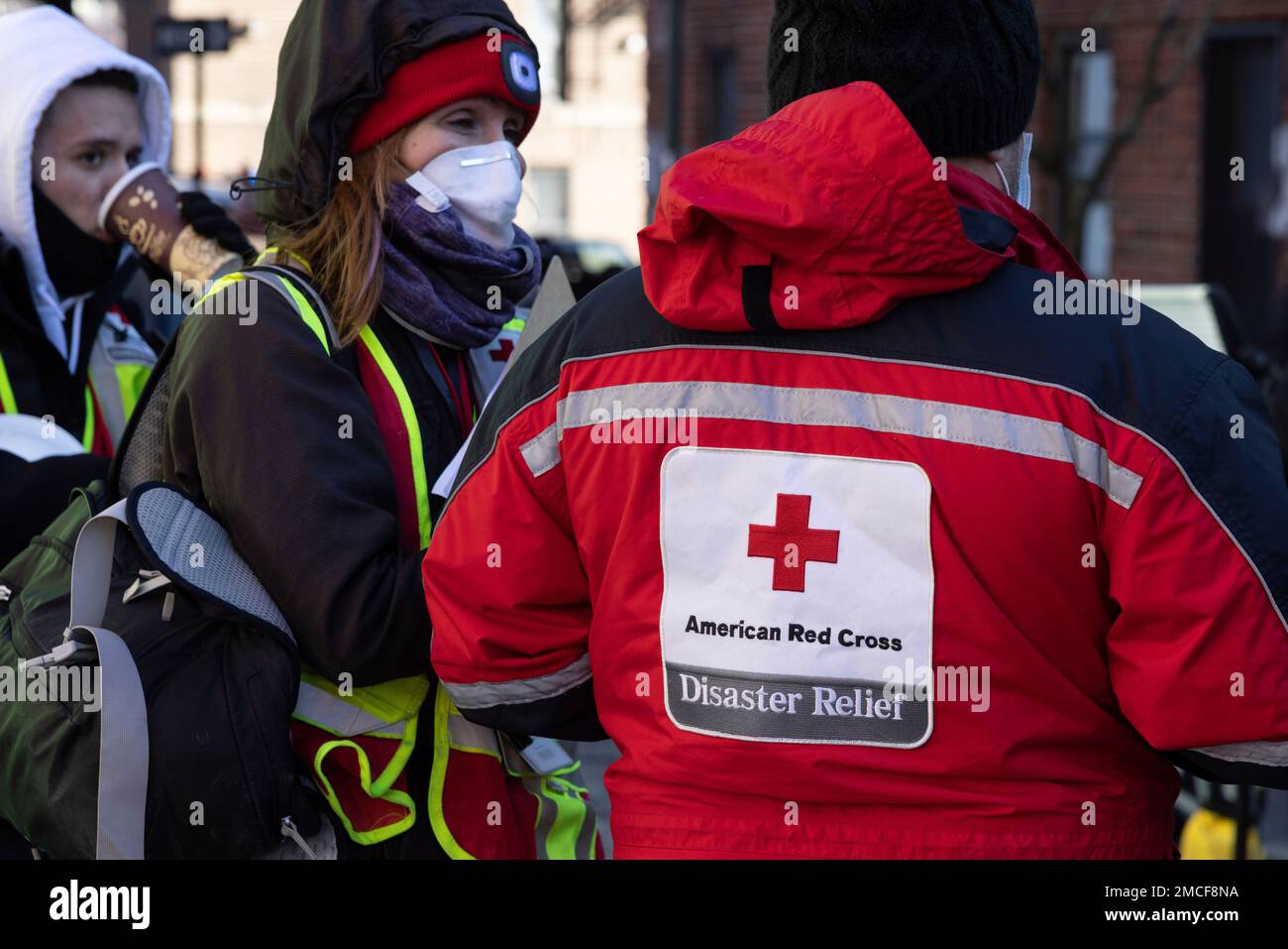 American Red Cross Disaster Relief team members are seen outside the ...