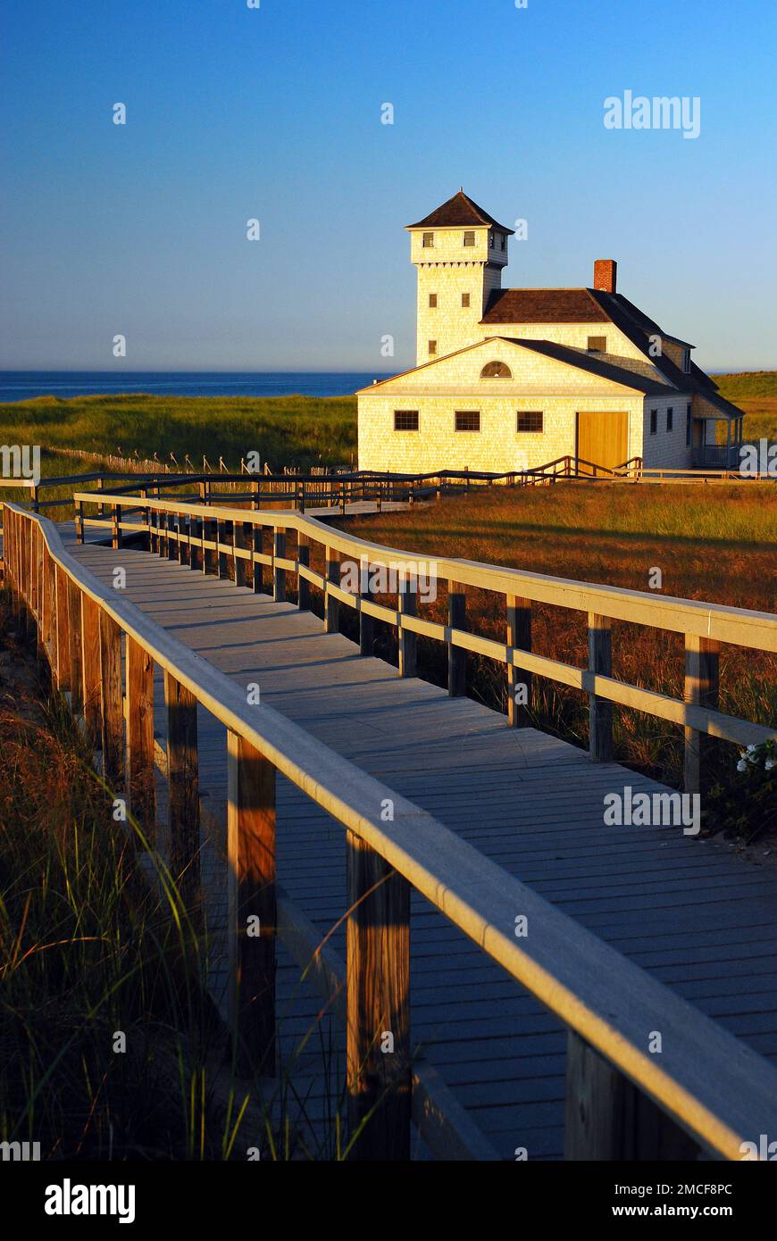 A boardwalk leads to the Race Point Life Saving Station at the northern tip of Cape Cod Stock ...