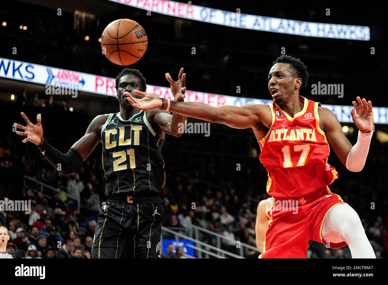 Atlanta Hawks forward Onyeka Okongwu (17) reaches for a rebound next to ...