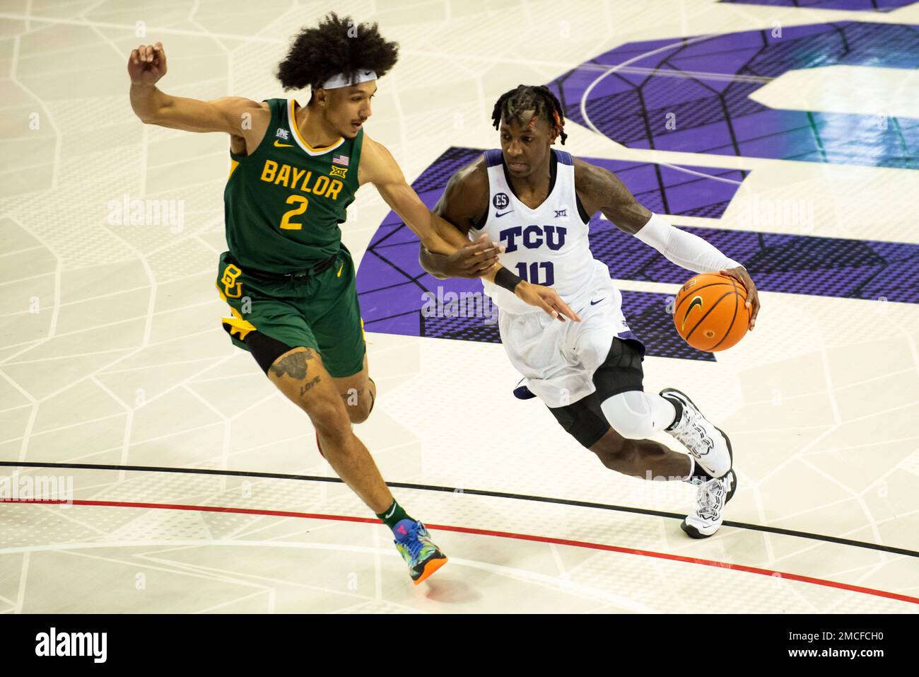 TCU guard Damion Baugh (10) attempts to drive past Baylor guard Kendall ...