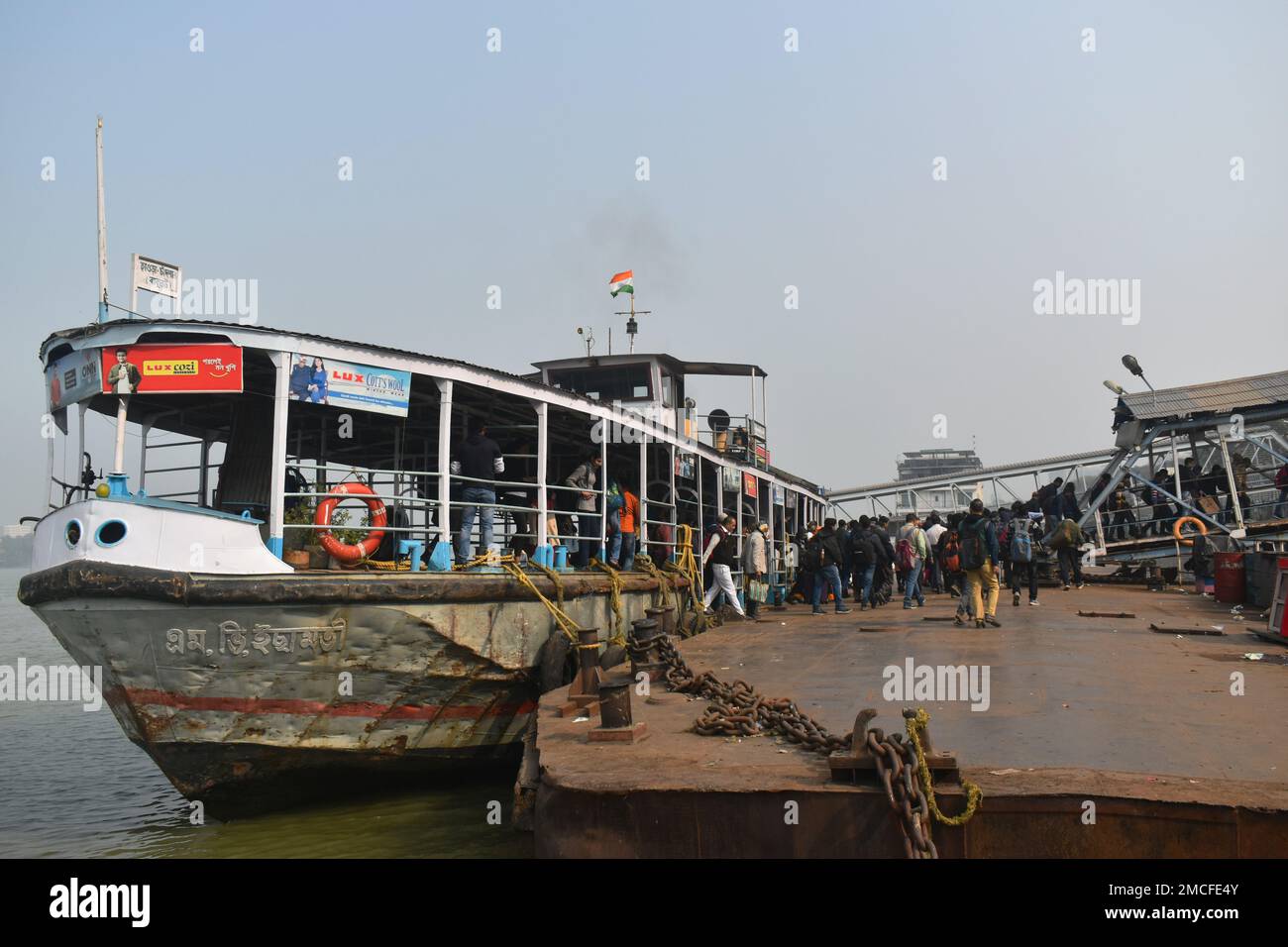 Kolkata, India. 21st Jan, 2023. People are traveling on the water ...