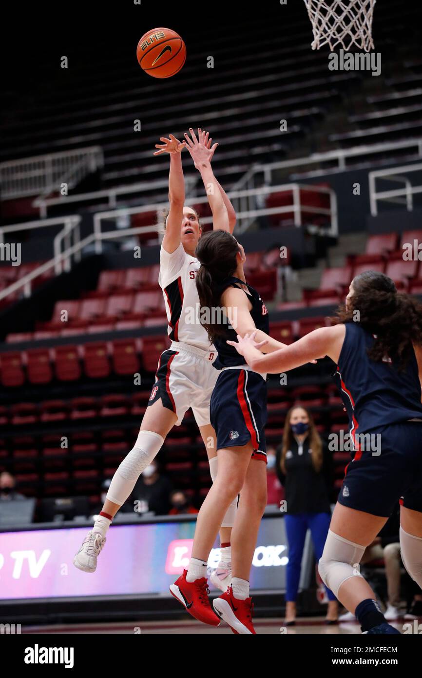 Stanford guard Lexie Hull, left, aims for the basket to score against ...