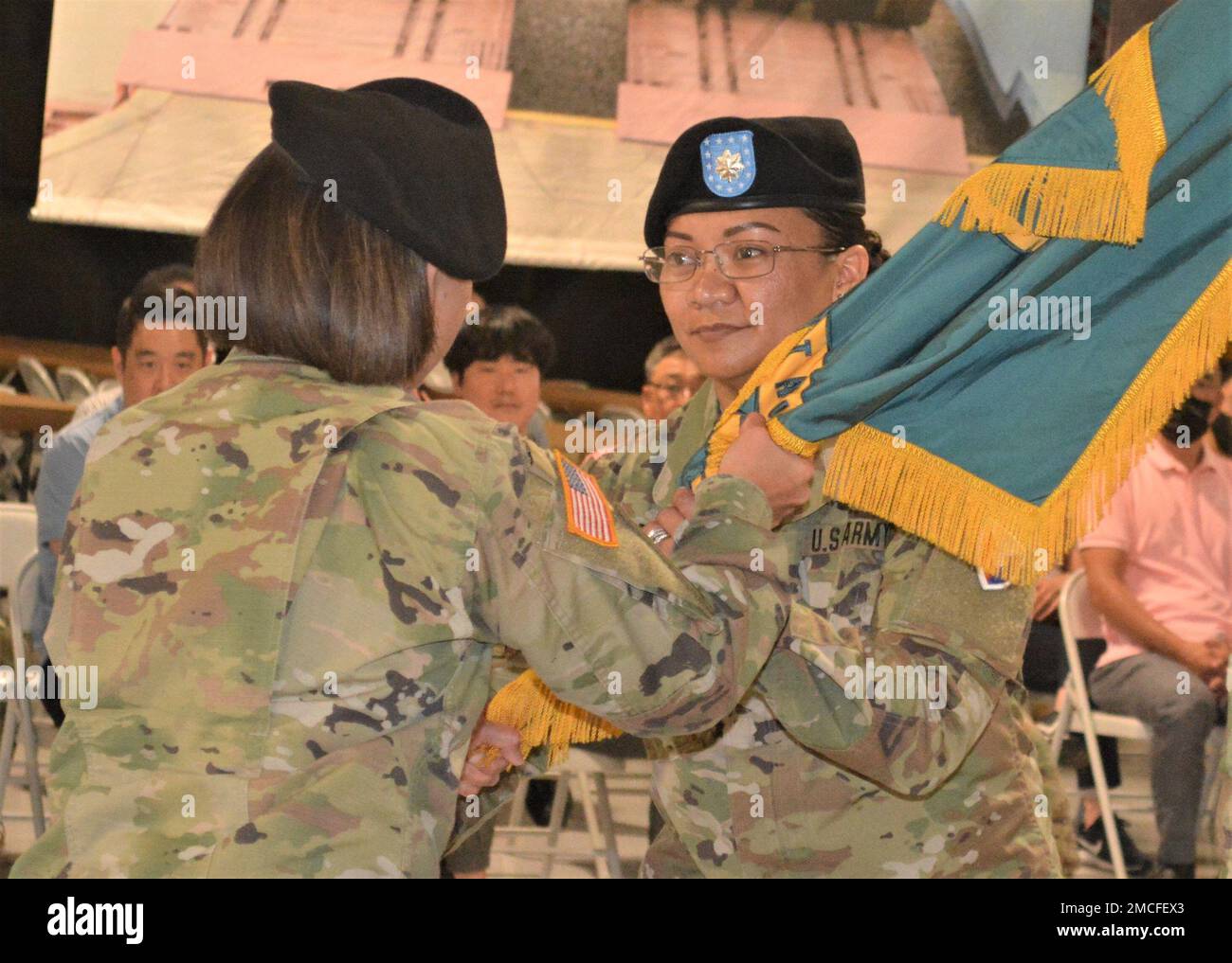 Col. Lisa Rennard, commander, 403rd Army Field Support Brigade, passes ...