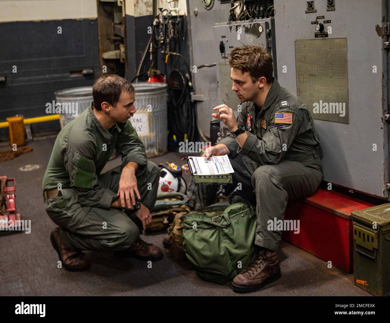 EAST CHINA SEA (June 30, 2022) Lt. Colin Greve, left, from Newberg ...