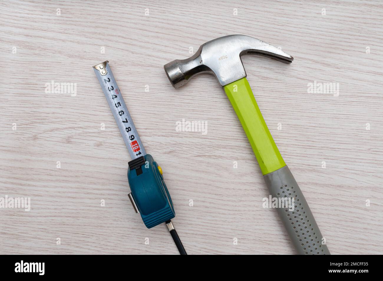 Various household tools such as hammer and tape measure screwdriver ...