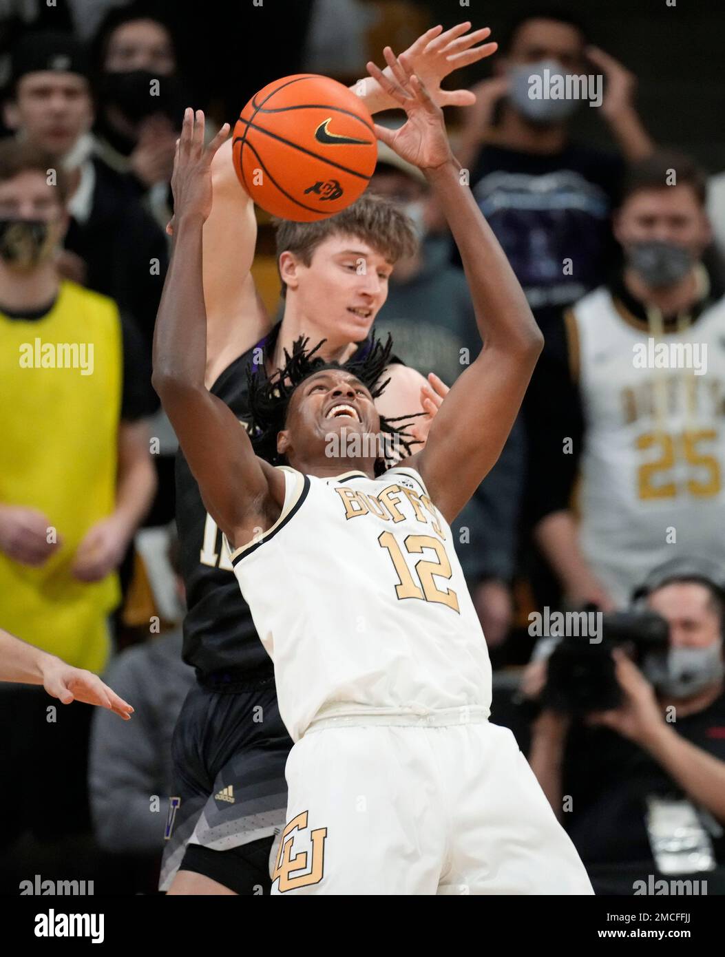 Colorado forward Jabari Walker, front, fights for control of a rebound ...
