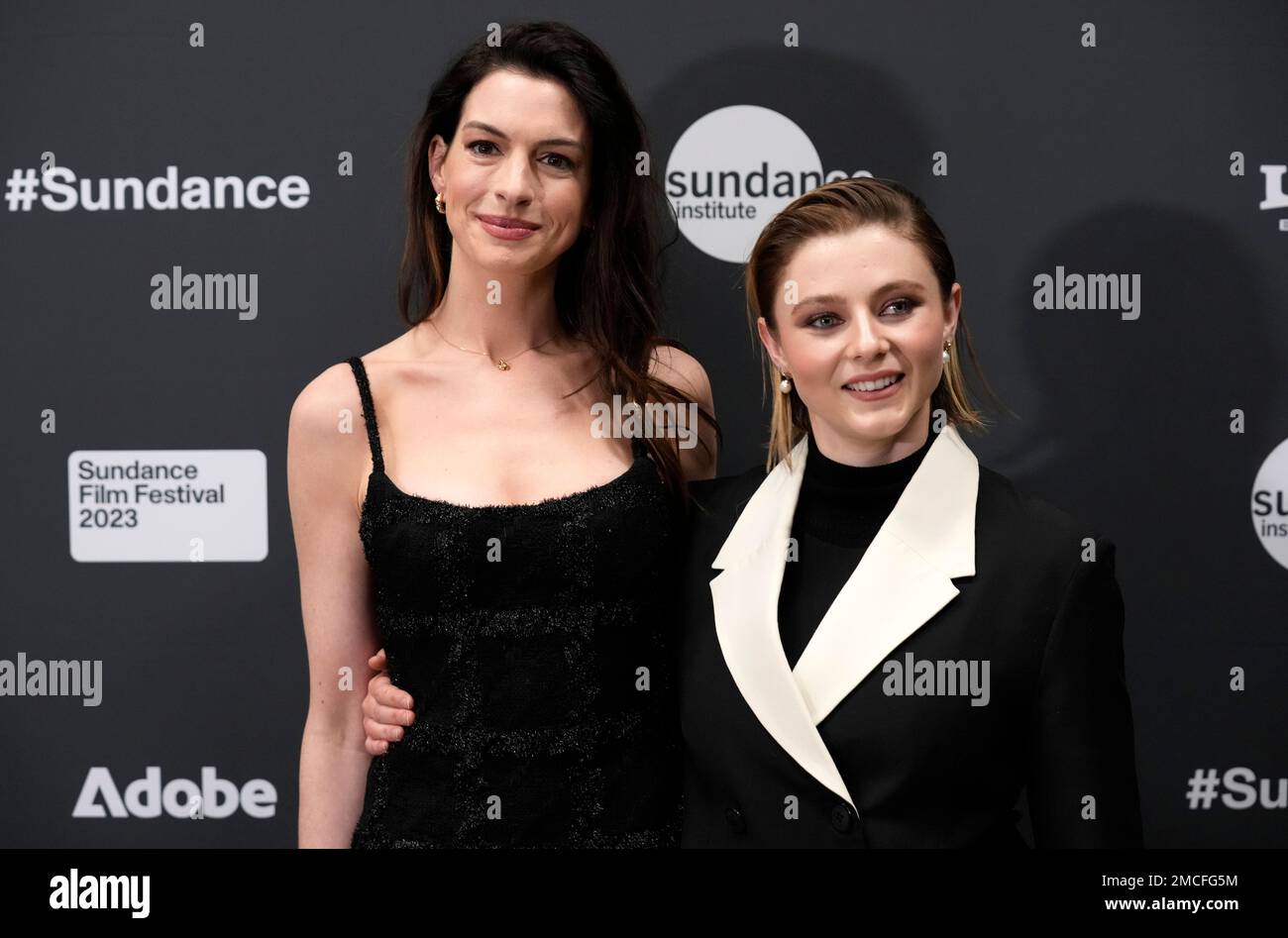 Anne Hathaway, left, and Thomas McKenzie, cast members in "Eileen ...