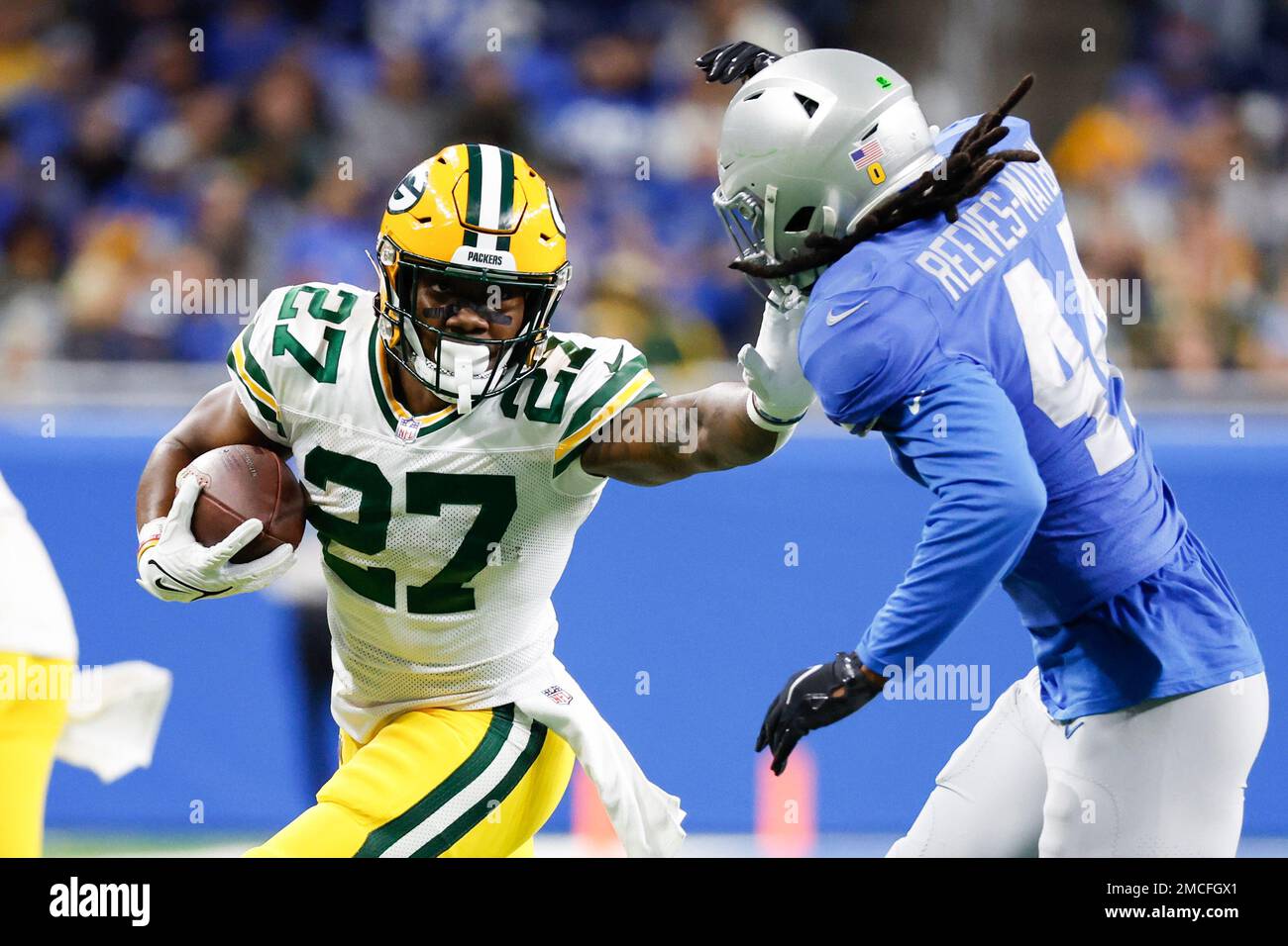 Green Bay Packers running back Patrick Taylor (27) stiff arms Detroit ...