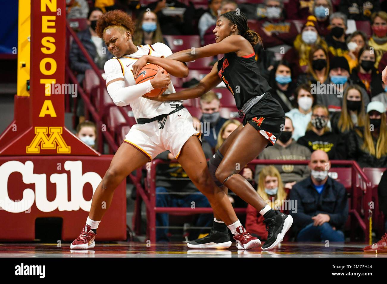 Minnesota guard Alexia Smith, left and Maryland guard Diamond Miller ...