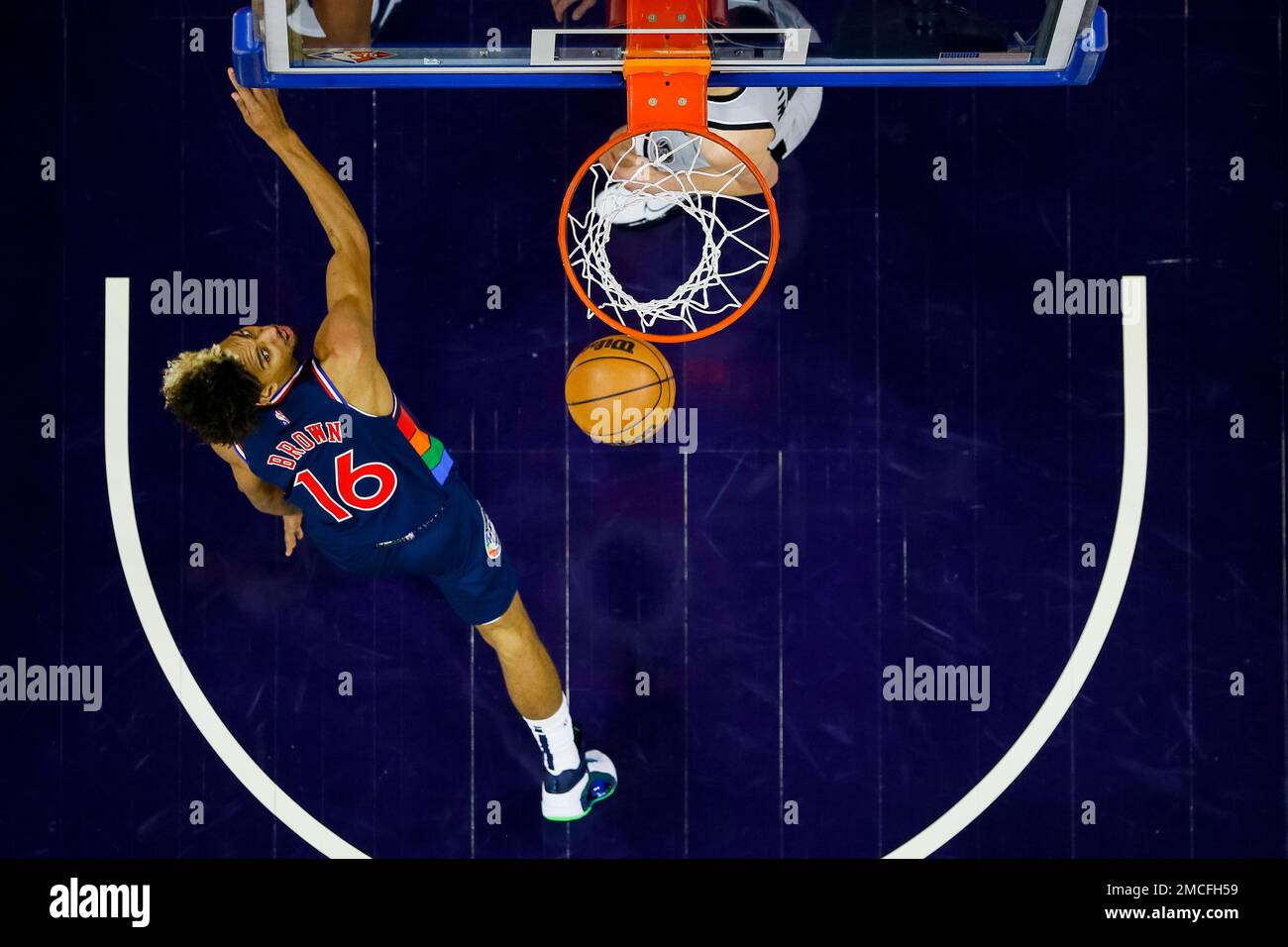 Philadelphia 76ers' Charlie Brown Jr., left, puts up the shot against ...