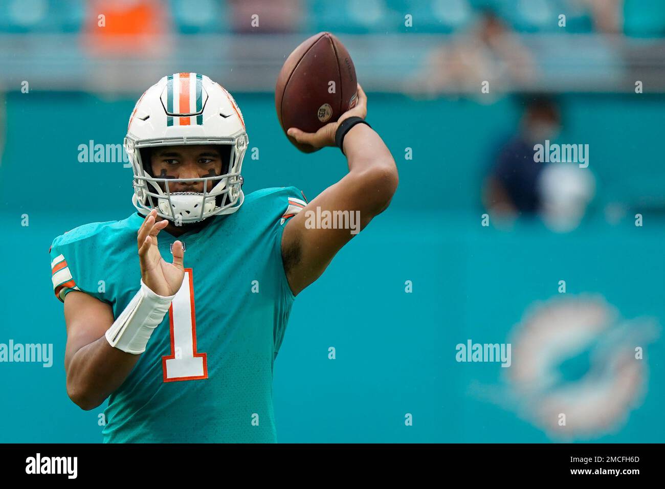 Miami Dolphins quarterback Tua Tagovailoa (1) passes during warm-ups ...