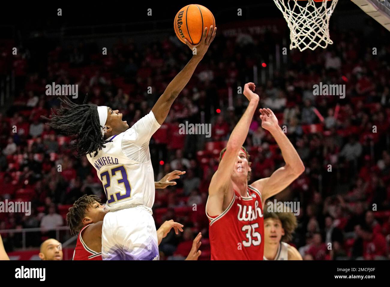 Washington guard Keyon Menifield (23) goes to the basket as Utah center ...