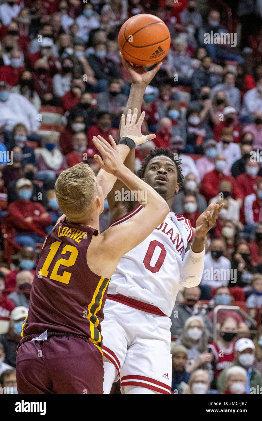 Indiana guard Xavier Johnson (0) shoots over the defense of Minnesota ...