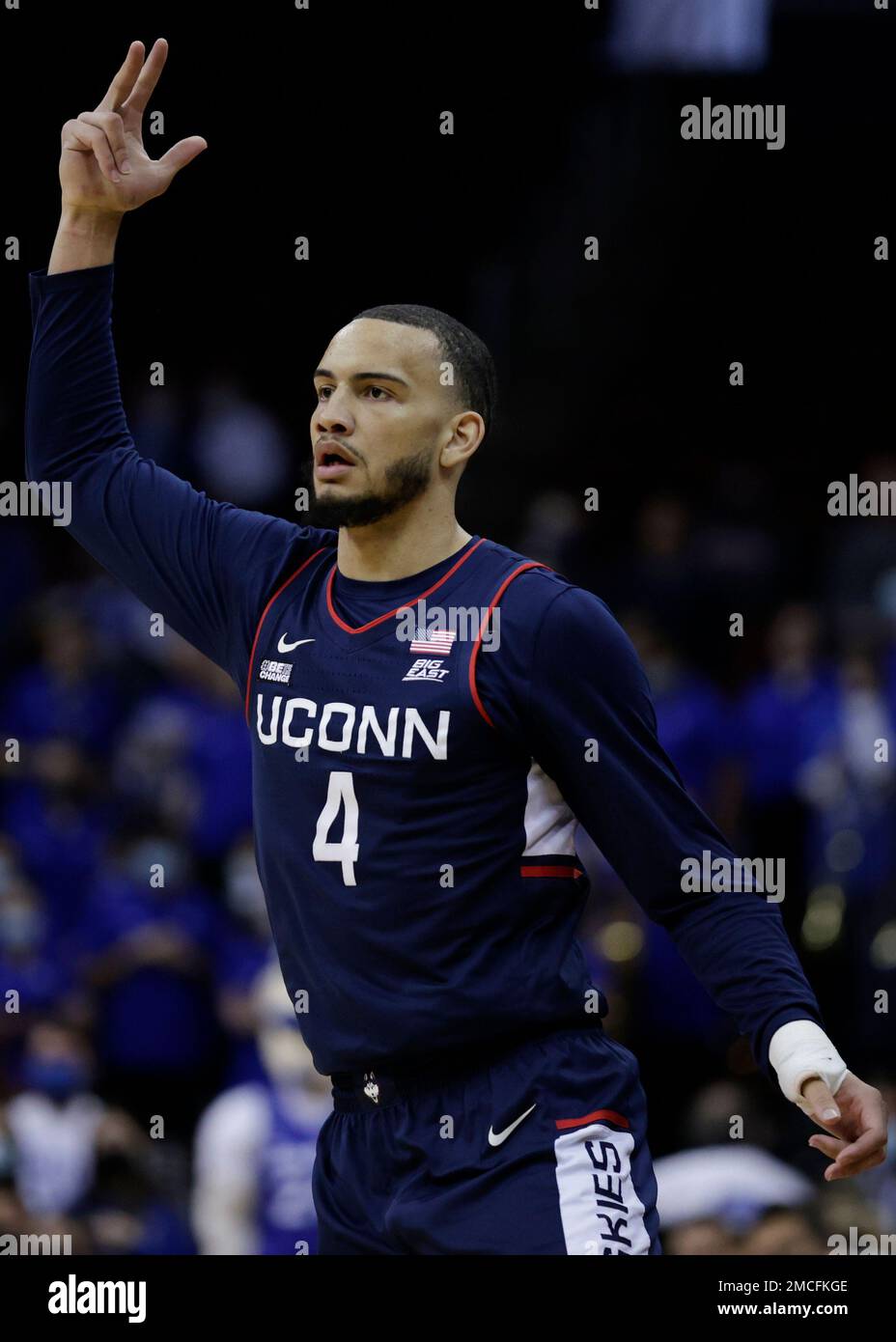 Connecticut guard Tyrese Martin (4) reacts against Seton Hall during ...