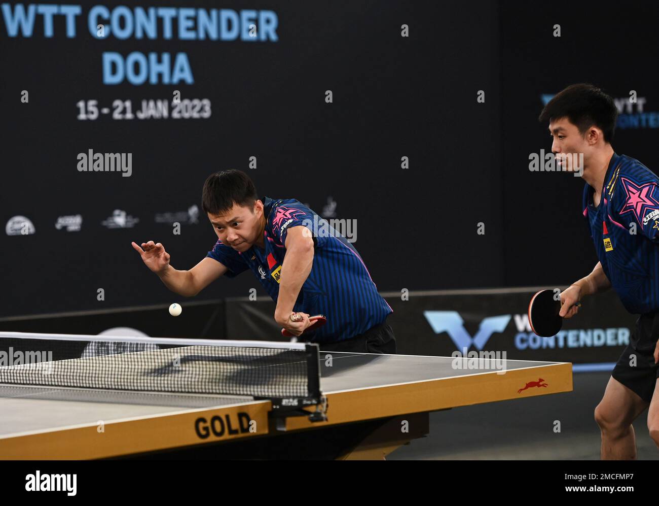 Doha, Qatar. 21st Jan, 2023. Yu Ziyang (L)/Zhou Kai of China compete ...