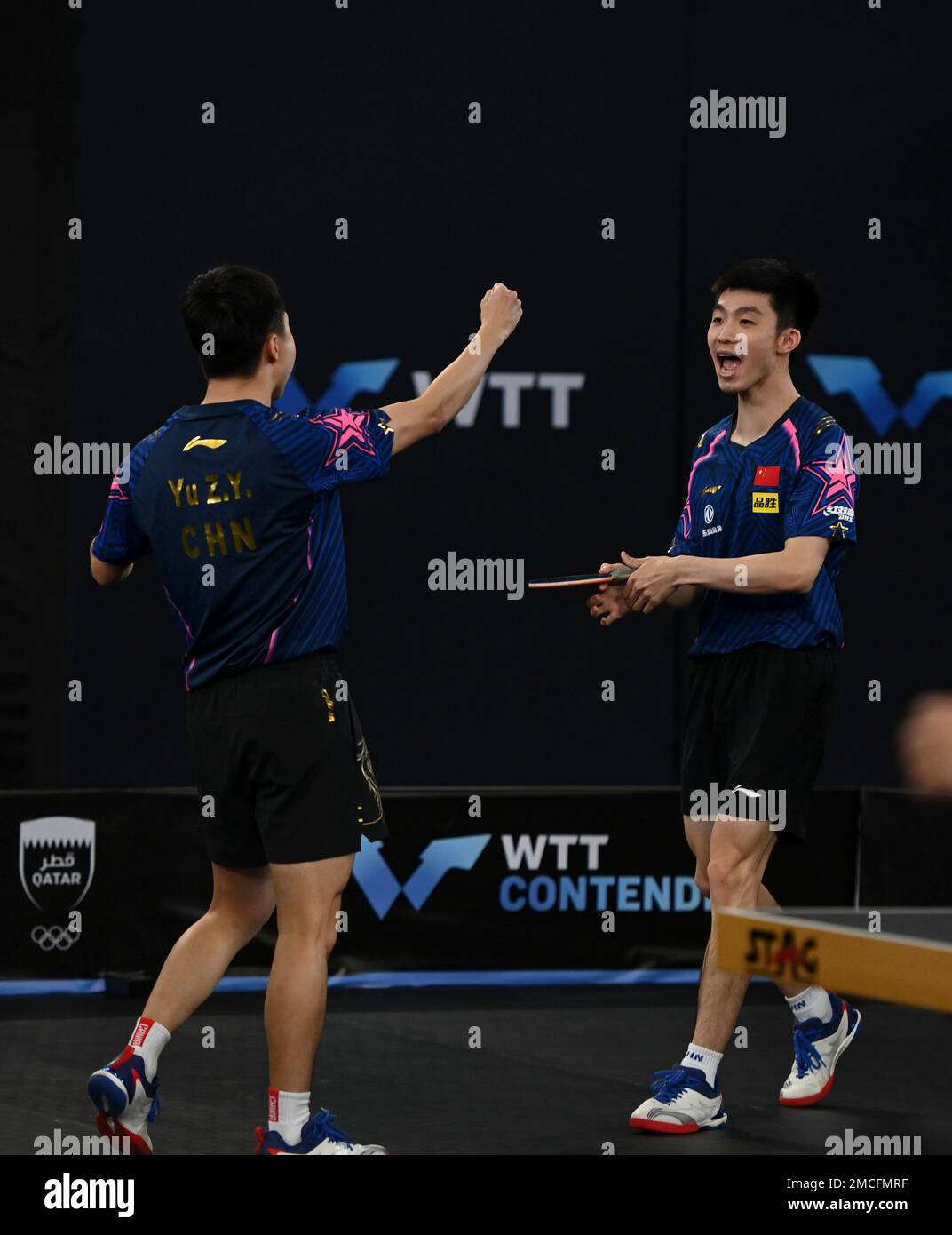 Doha, Qatar. 21st Jan, 2023. Yu Ziyang/Zhou Kai (R) of China celebrate ...