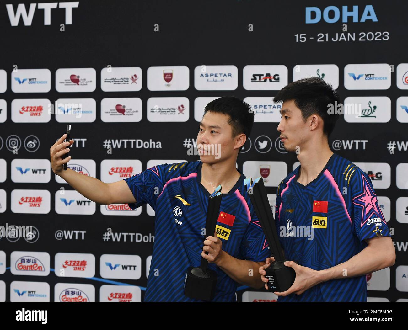 Doha, Qatar. 21st Jan, 2023. Yu Ziyang/Zhou Kai (R) of China take ...
