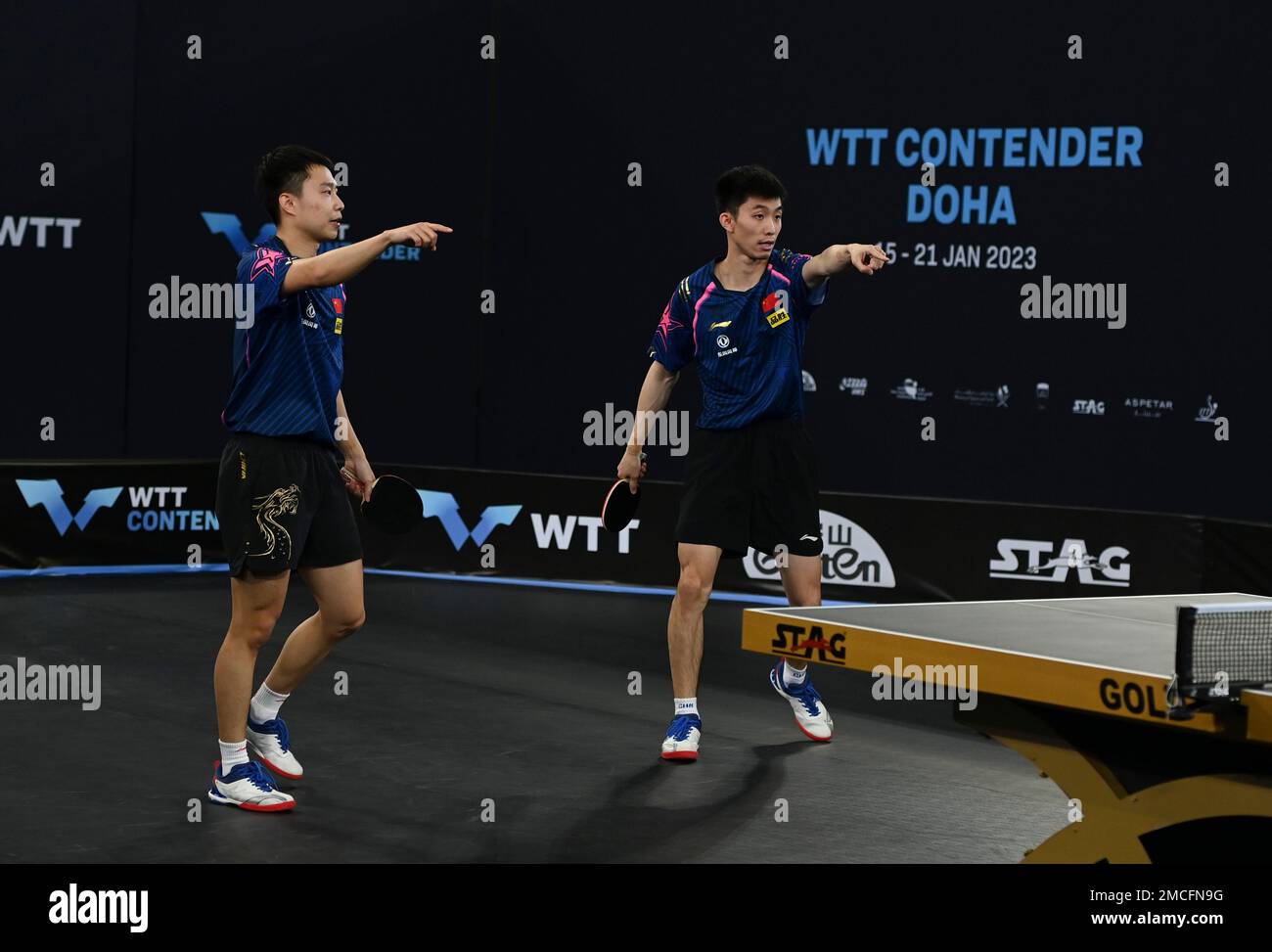 Doha, Qatar. 21st Jan, 2023. Yu Ziyang (L)/Zhou Kai of China react ...