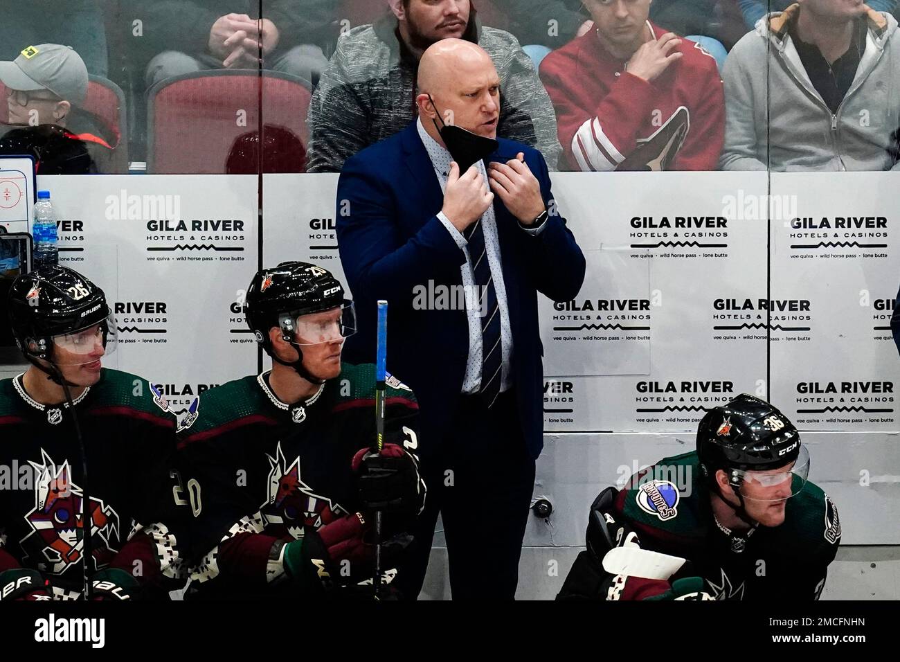 Arizona Coyotes head coach André Tourigny, center top, yells at the ...