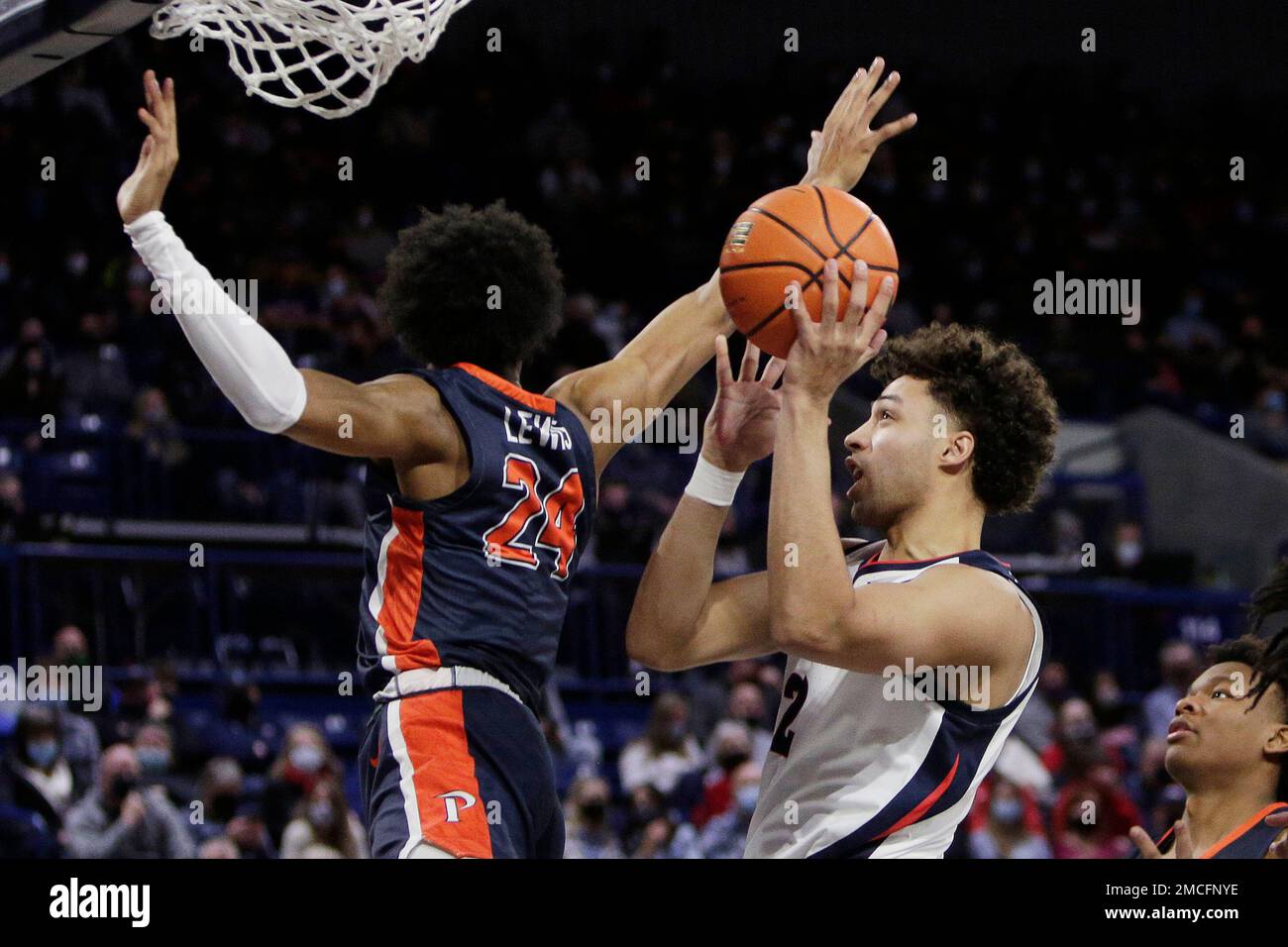 Gonzaga forward Anton Watson, right, shoots while pressured by ...