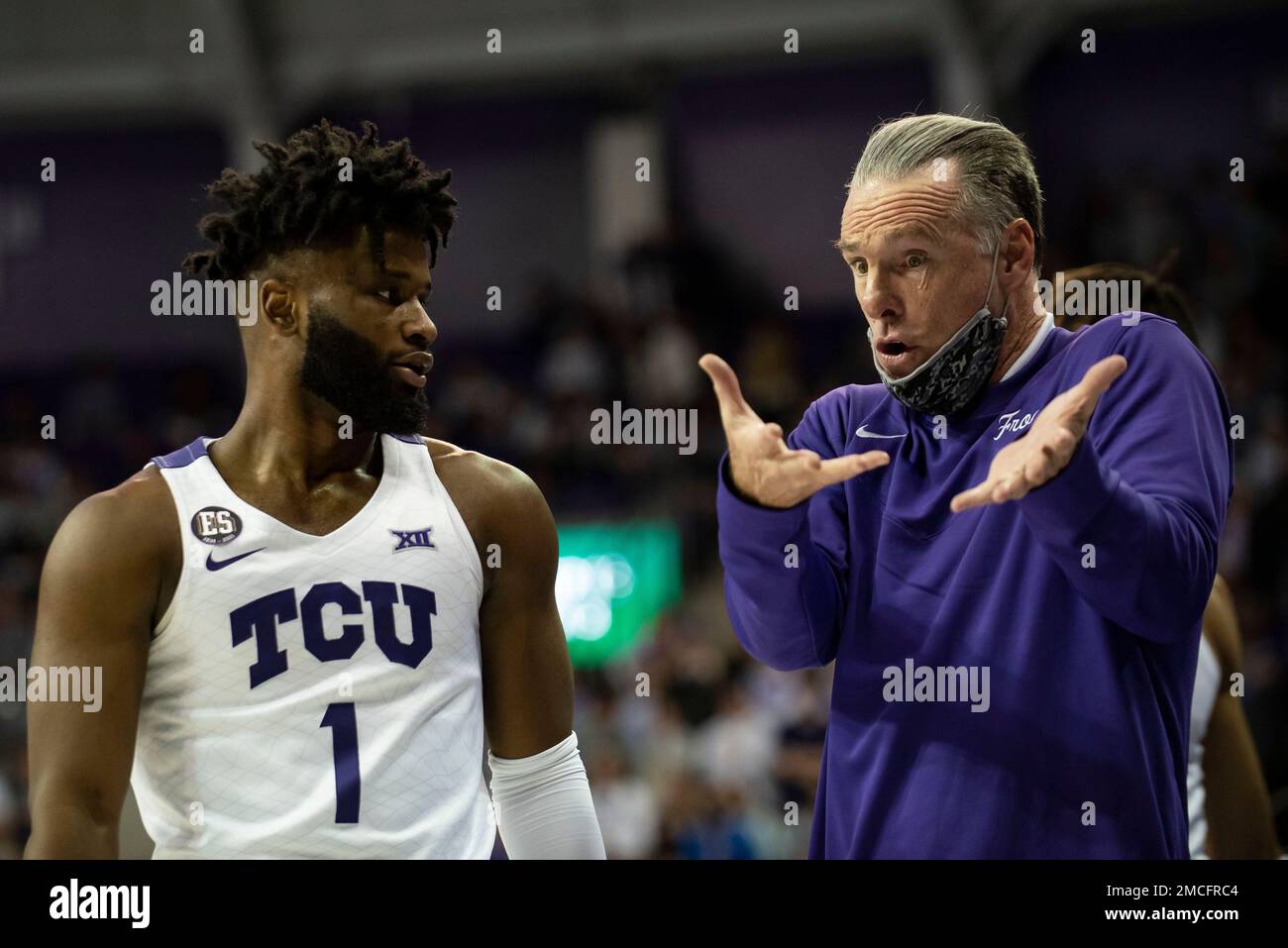TCU head coach Jamie Dixon, right, talks to guard Mike Miles (1) in the ...