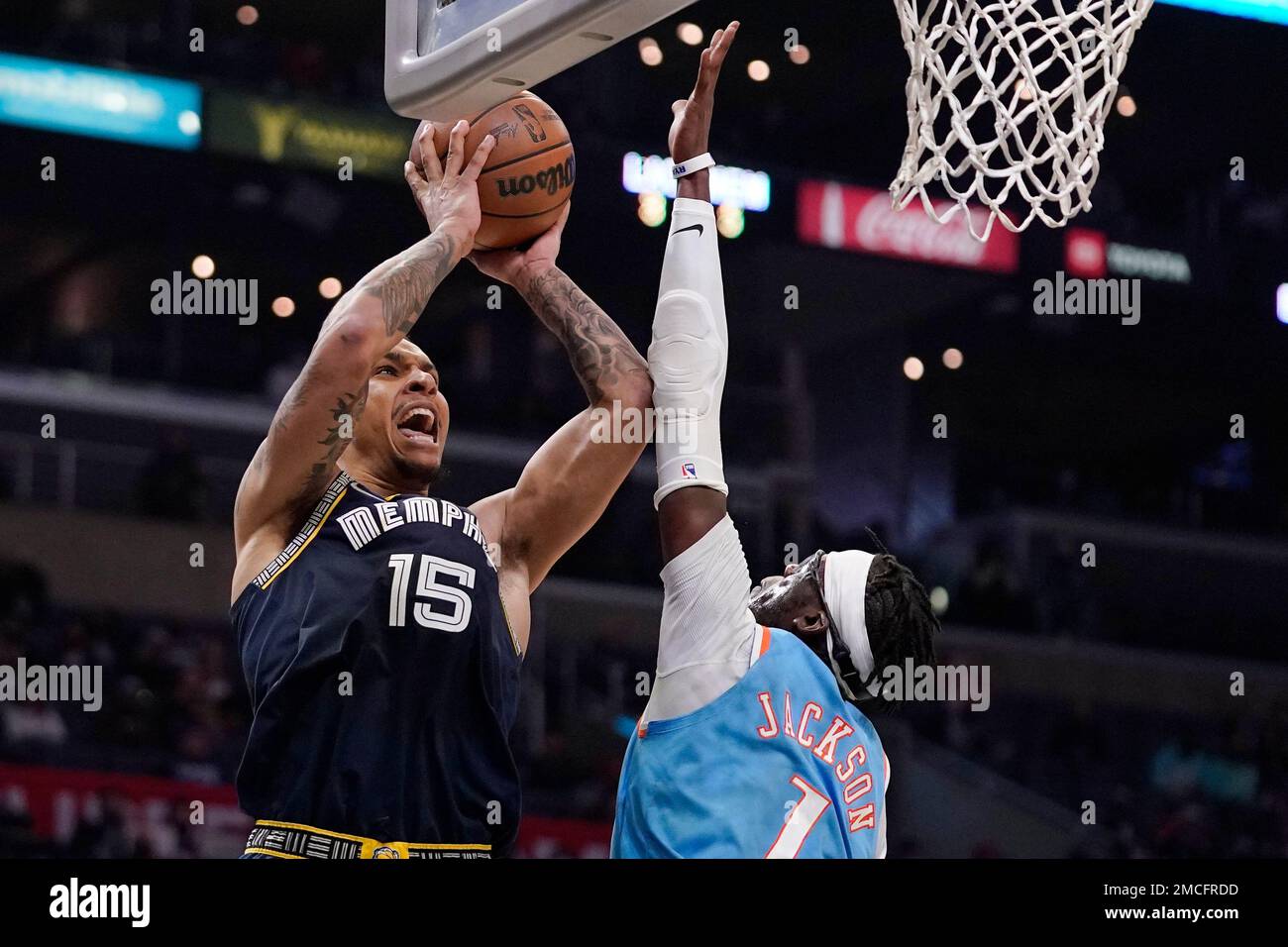 Memphis Grizzlies center Jon Teske, left, shoots as Los Angeles ...